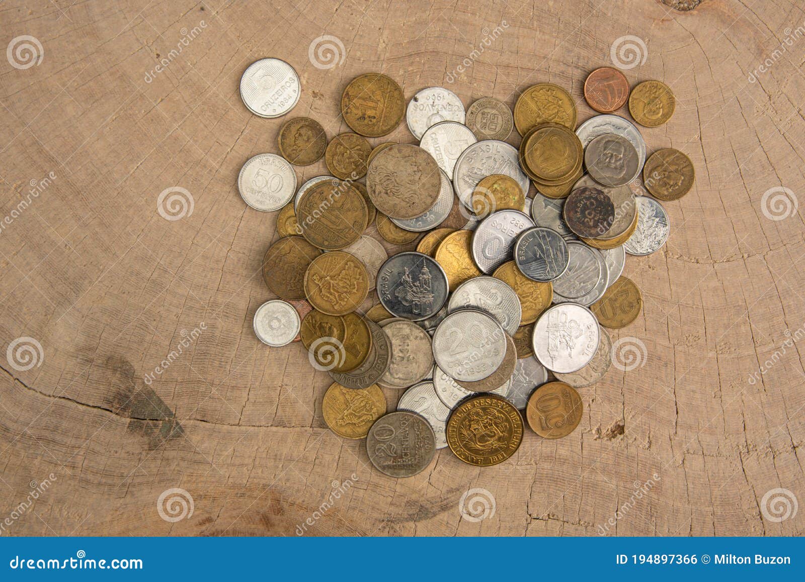 Old Coins Placed on a Rustic Wooden Platform, Top View Stock Photo ...