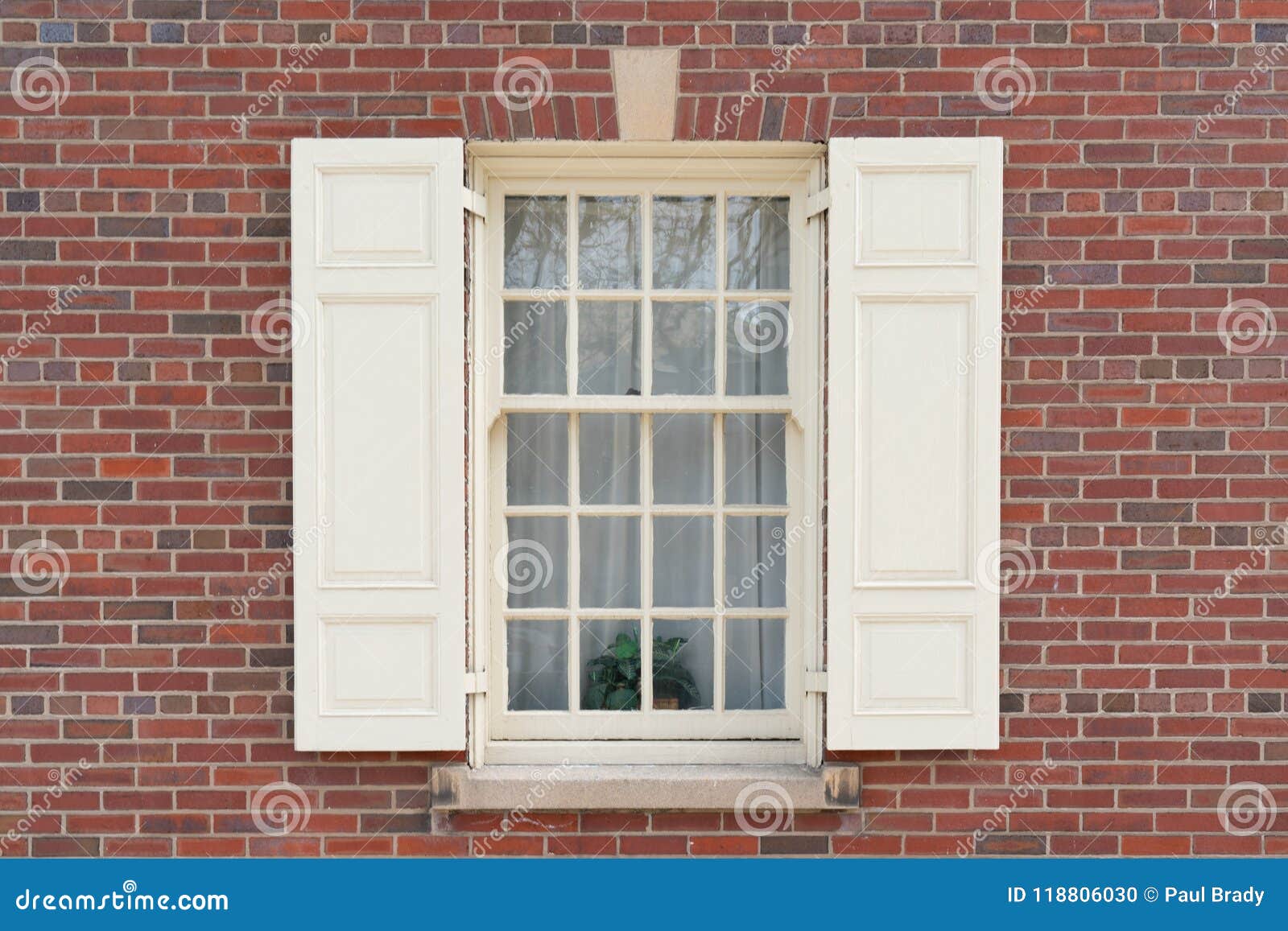 A Colonial Ear Window With A Small Balcony With Eroded Stucco Siding ...