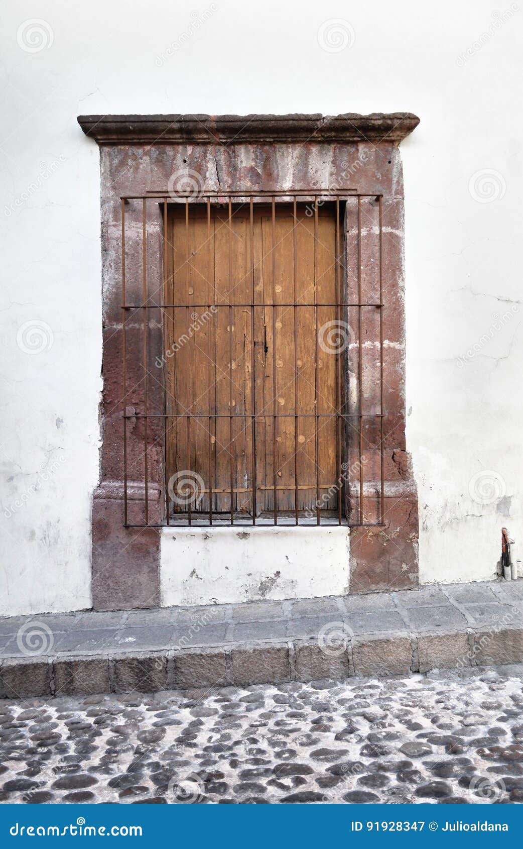 A Colonial Ear Window With A Small Balcony With Eroded Stucco Siding ...