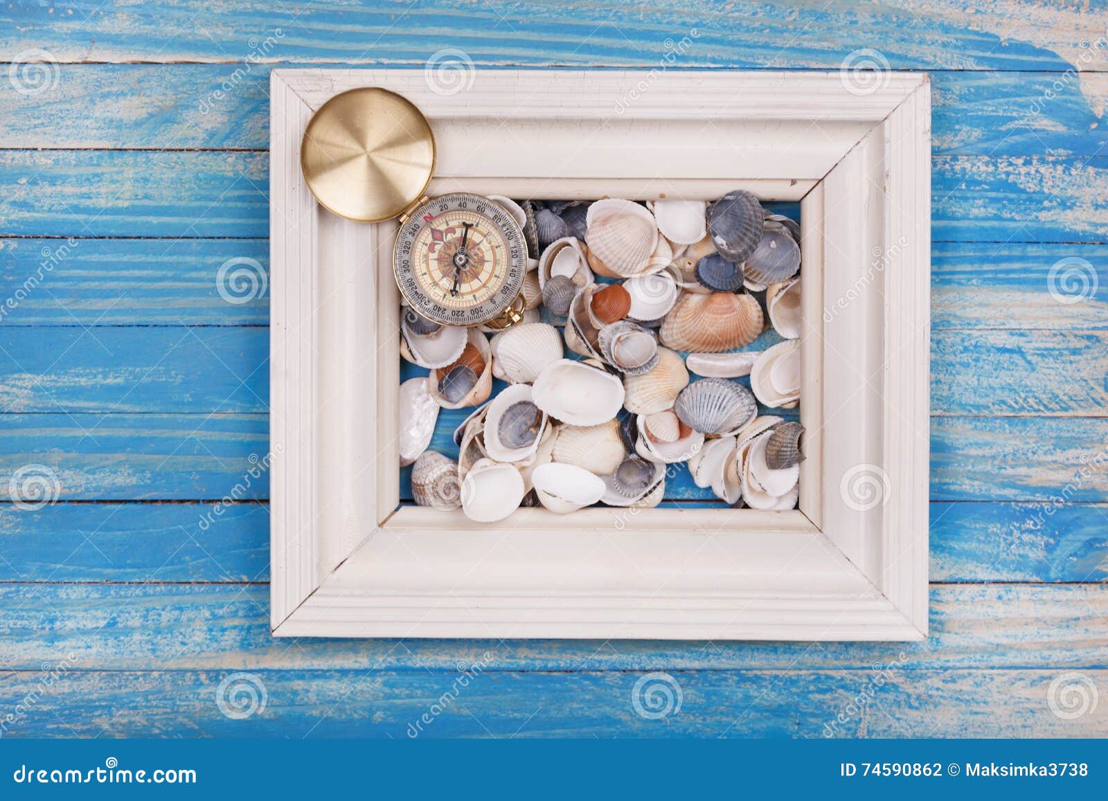 Old Compass in Photo Frame on Blue Background Stock Photo - Image of ...