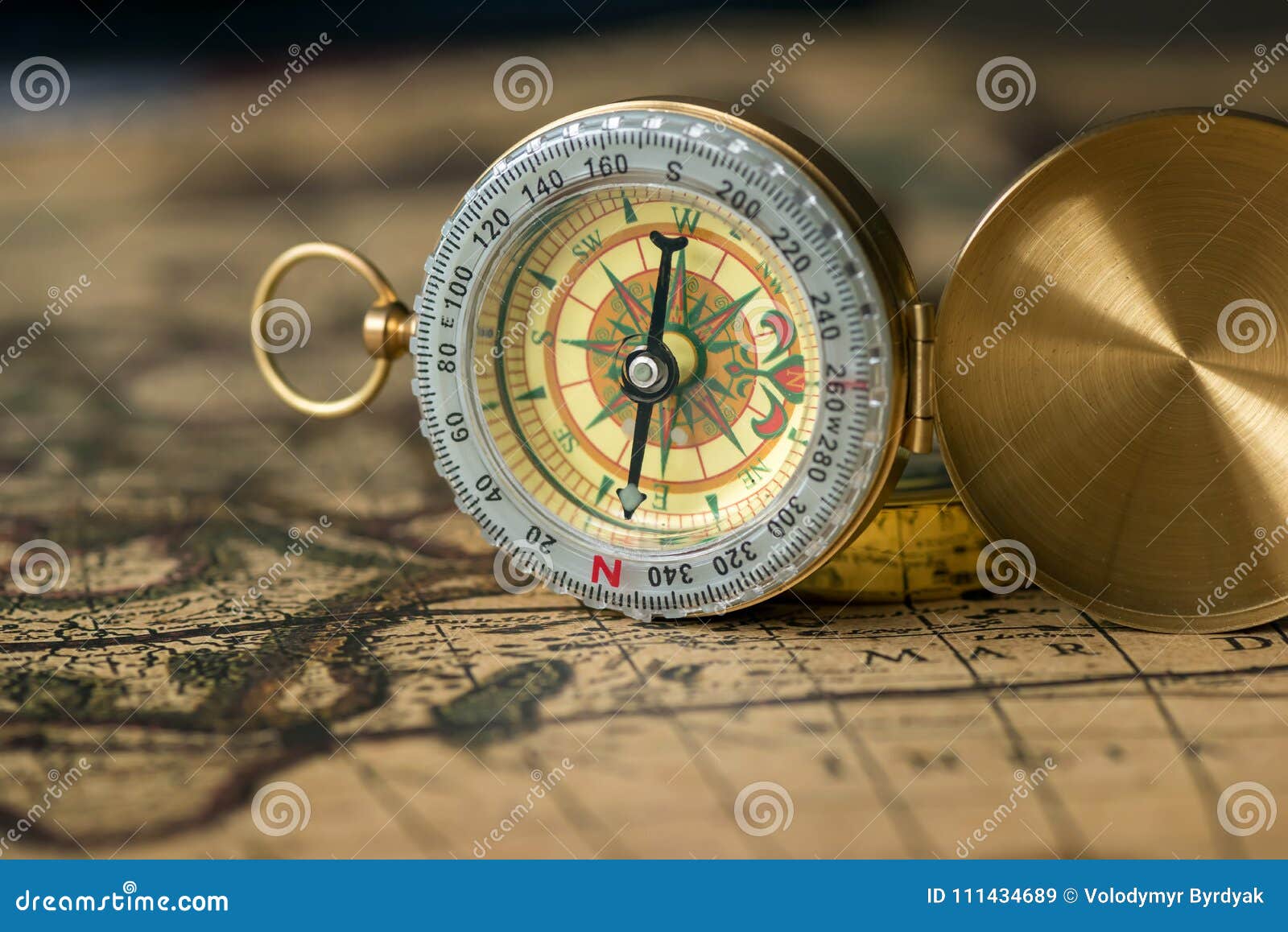 Old compass on vintage map stock image. Image of discovery - 111434689