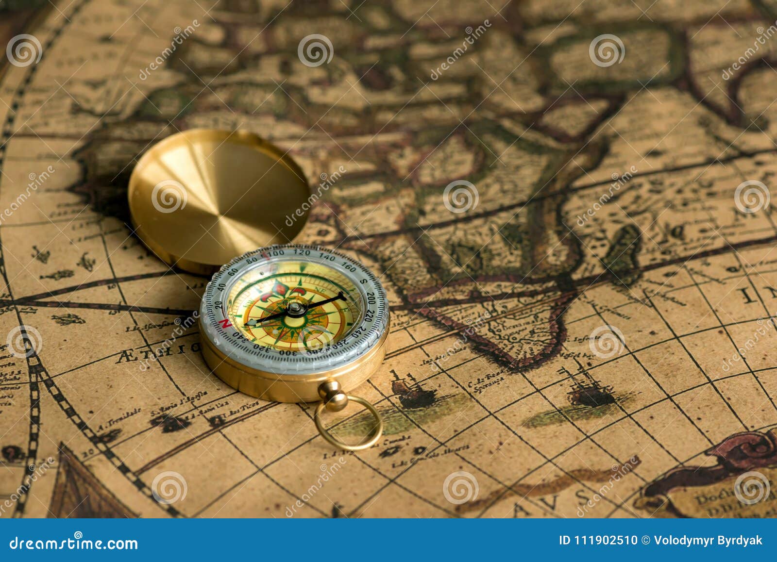 Old compass on vintage map stock photo. Image of business - 111902510