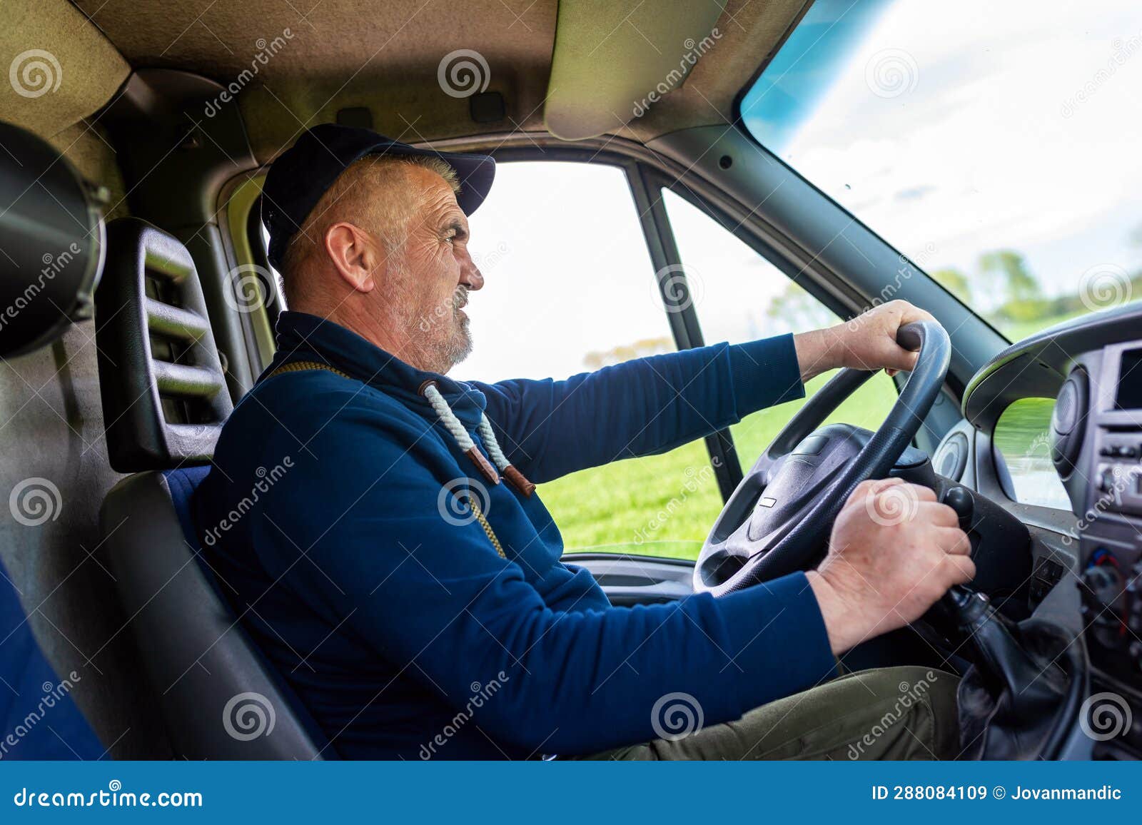 Mature Confident Truck Driver is Looking Carefully at the Road Stock ...