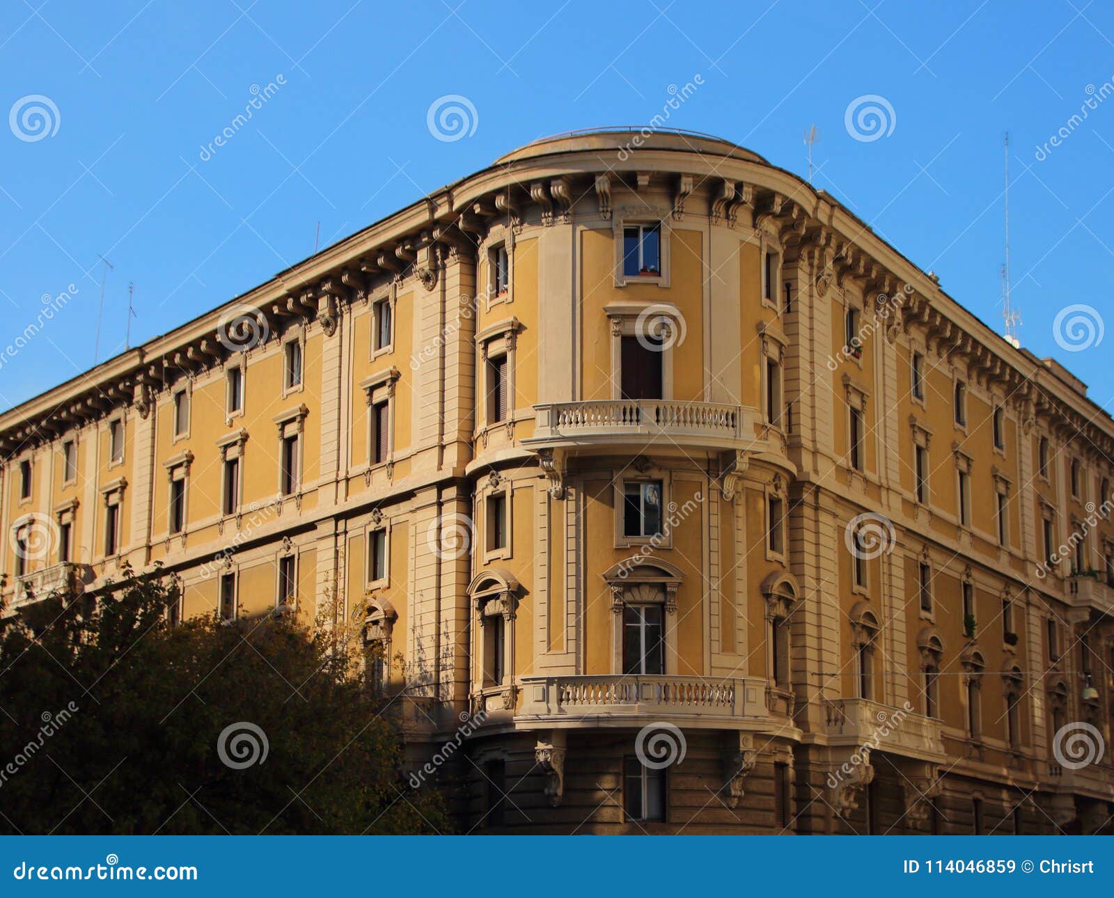 A Corner Apartment Building With Circular Round Balcony, Railings And ...