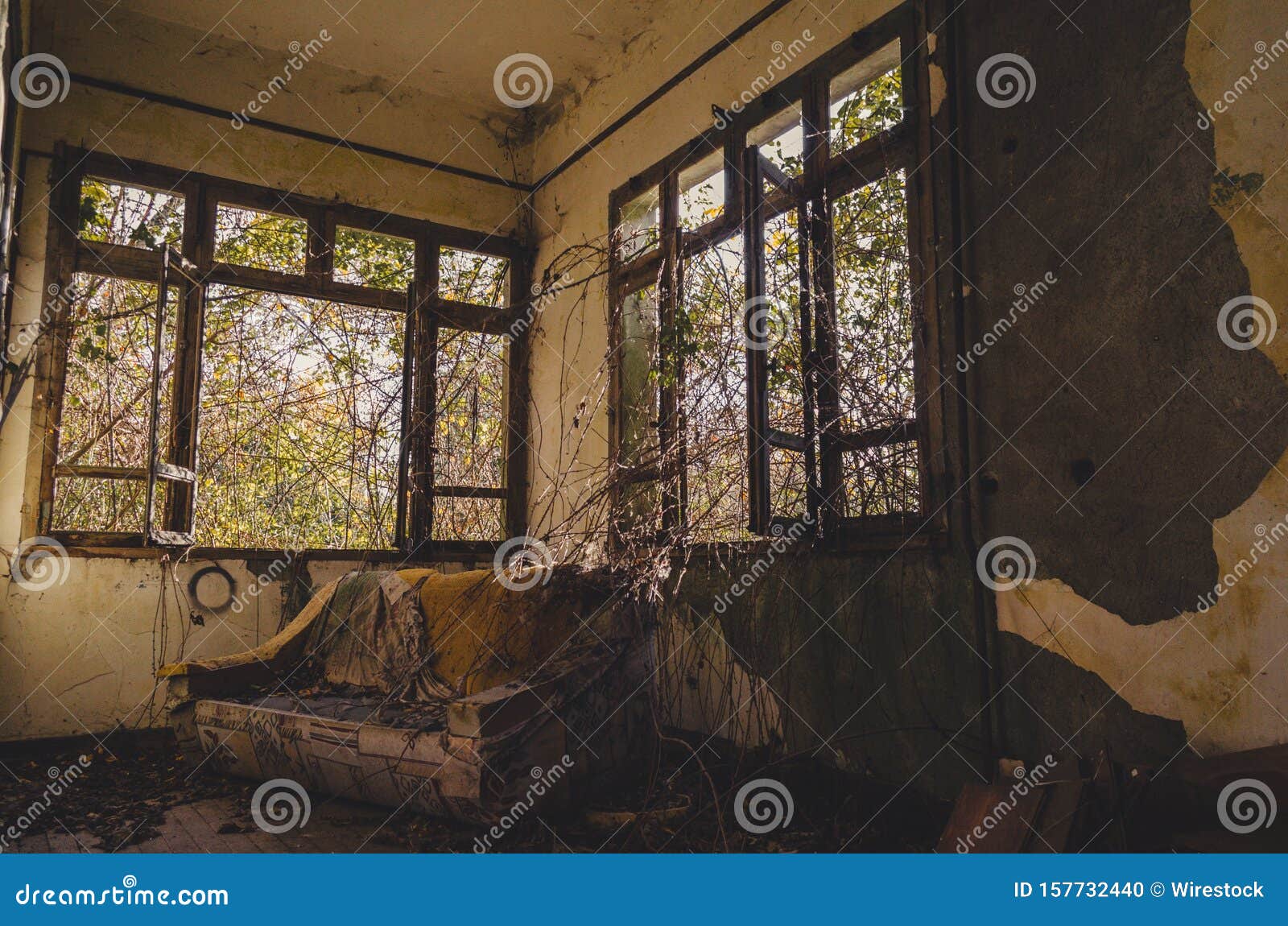 Old Couch Inside of a House with Rusty Walls and Broken Windows Stock ...