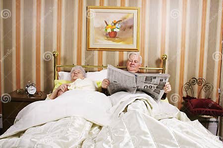 Old couple in bed stock image. Image of relationship, orange - 4122891