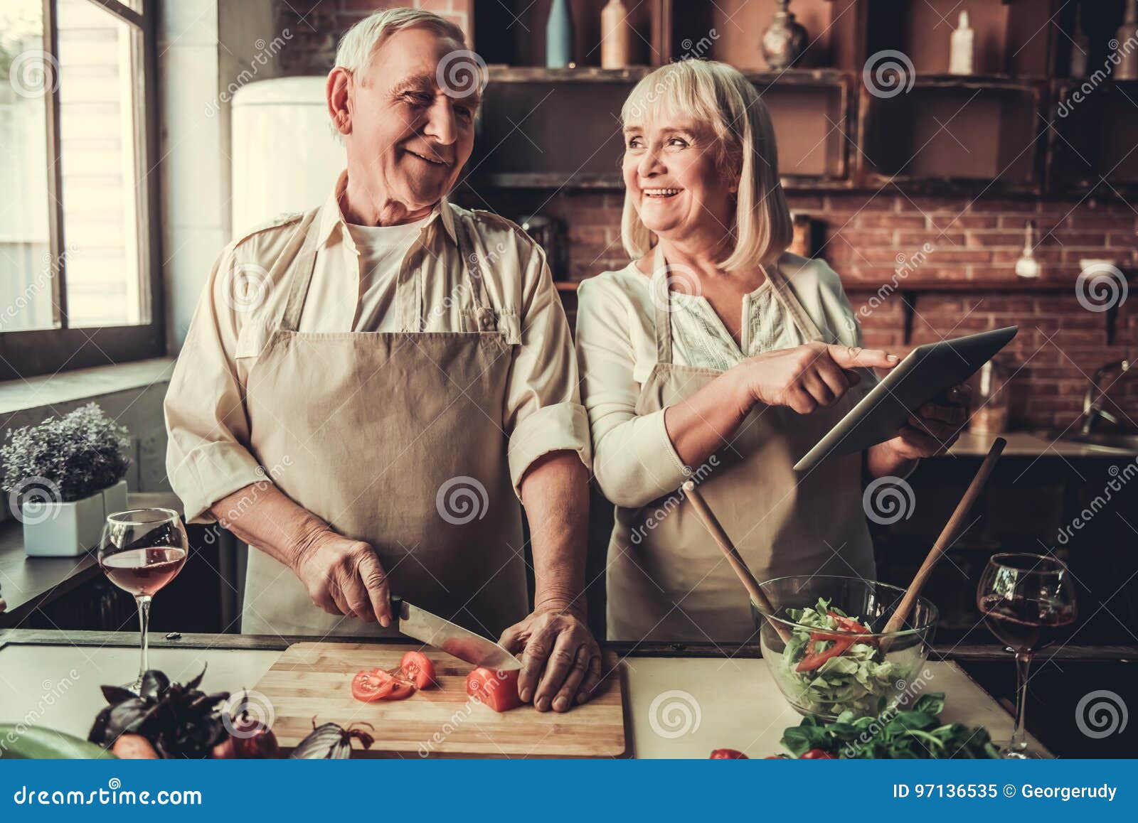 Old couple in kitchen stock image. Image of housewife - 97136535