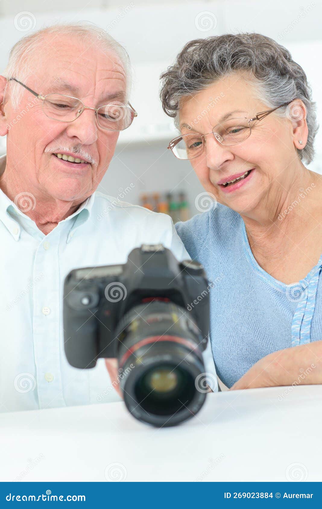 Old Couple Looking on Camera Screen with Pictures Stock Photo - Image ...