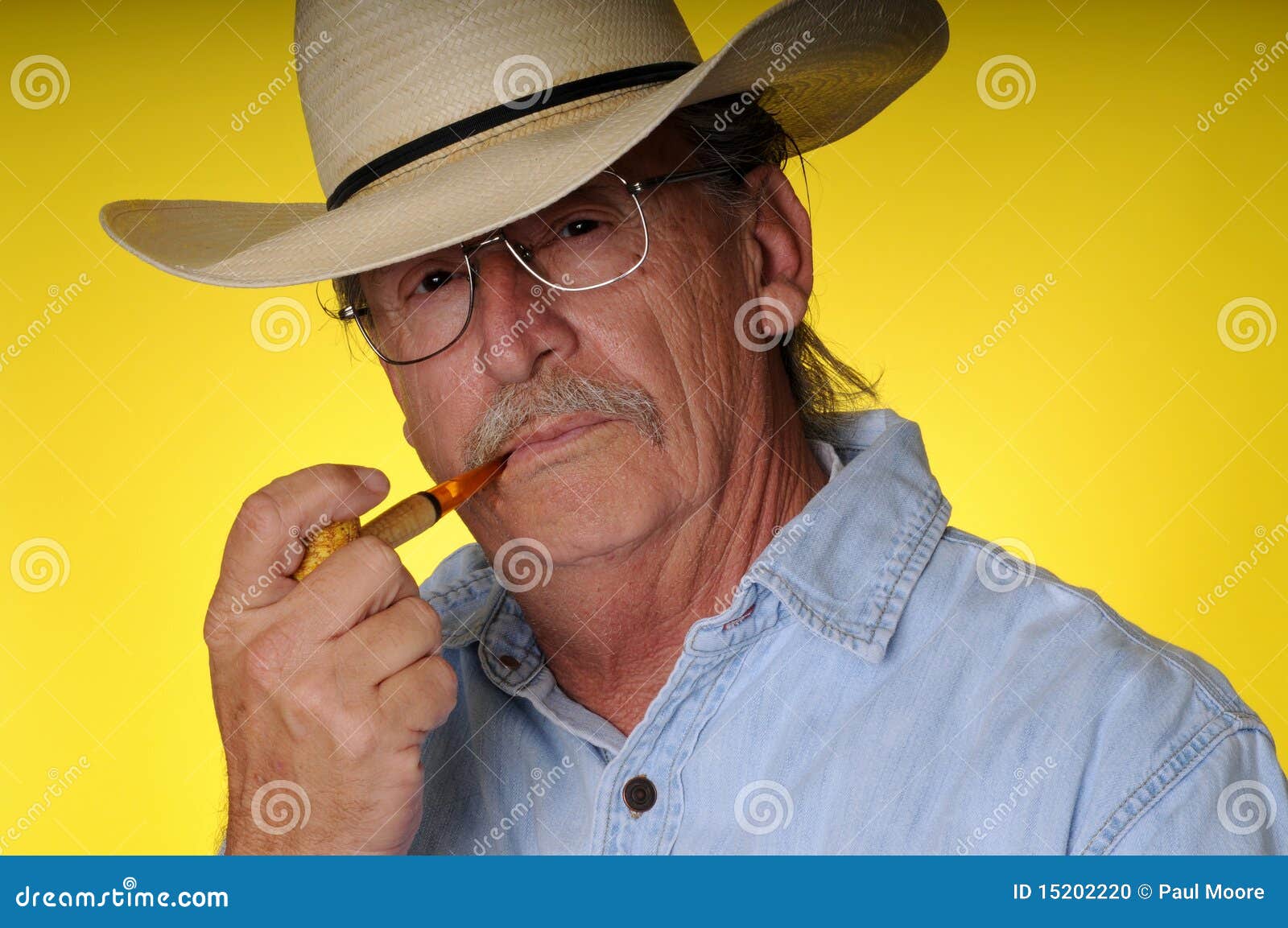 Old Cowboy and Pipe stock photo. Image of pipe, looking - 15202220