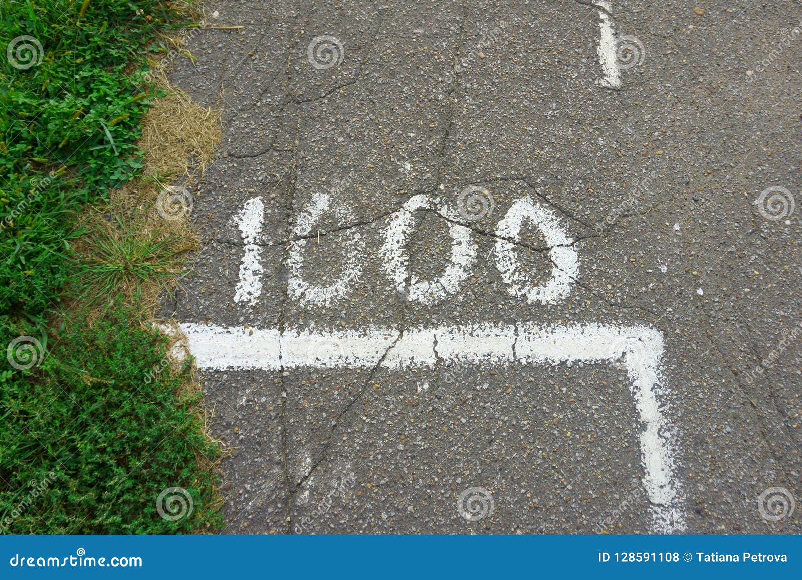 Old Cracked Jogging Track. Marking 1000 on Asphalt Stock Photo - Image ...