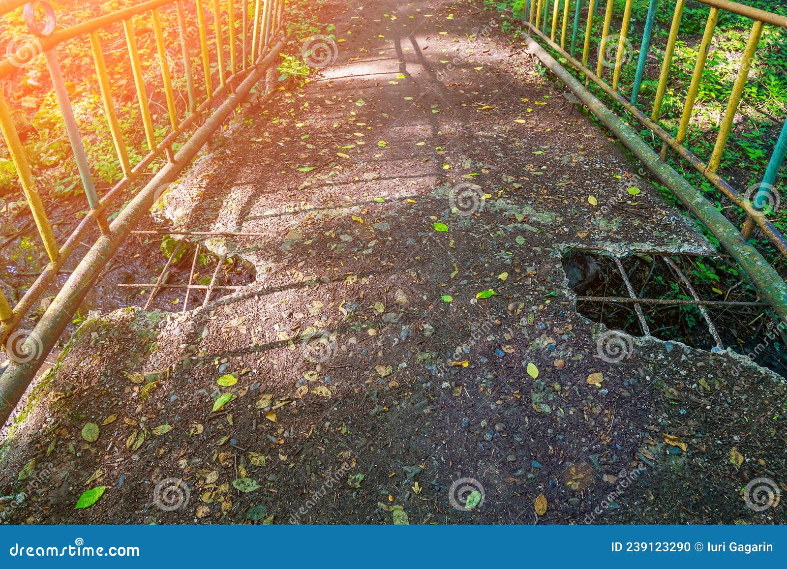 An Old Crumbling Concrete Footbridge Across the River. Background with ...