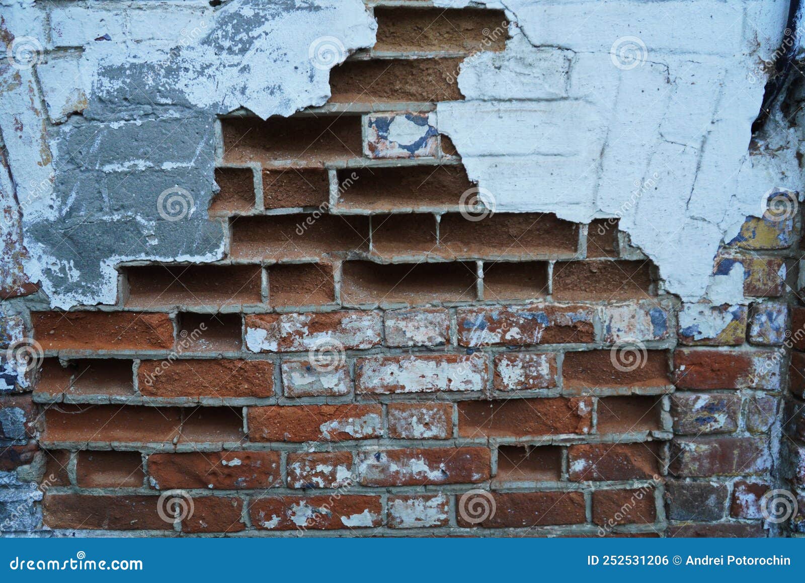 An Old Crumbling Wall with Destroyed Bricks between a Strong Masonry ...