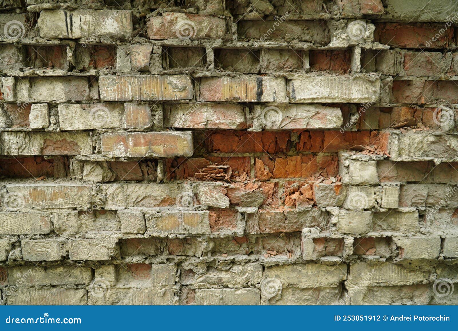 An Old Crumbling Wall with Destroyed Bricks between a Strong Masonry ...