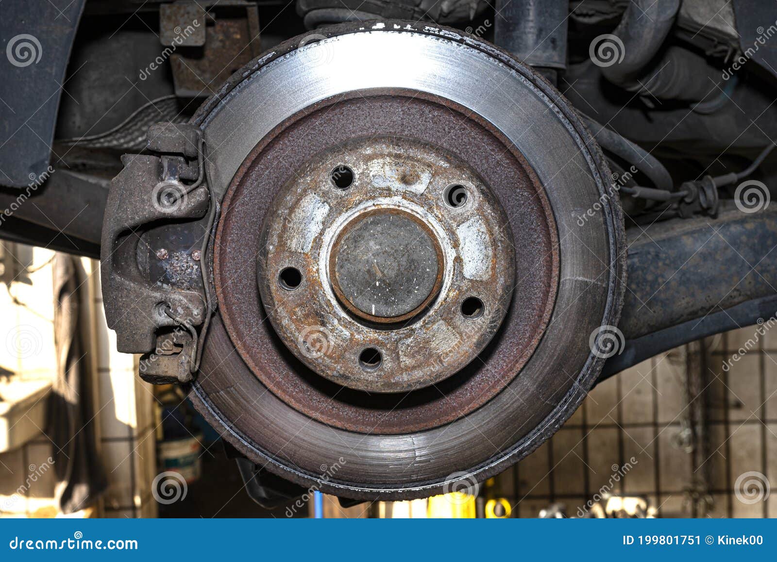 Old and Damaged Rear Brake Discs with Caliper and Brake Pads in the Car ...