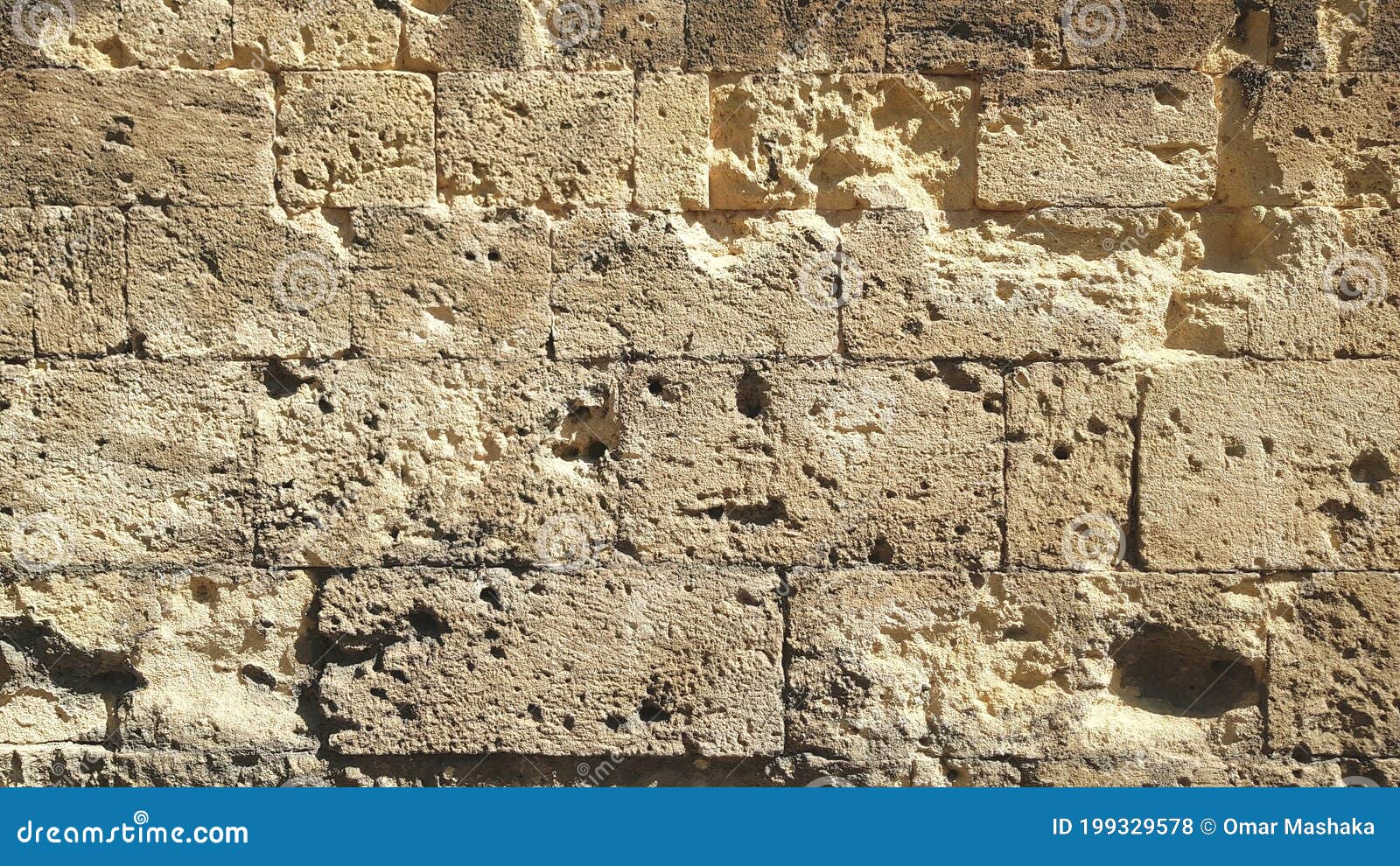 An old damaged stone wall stock photo. Image of design - 199329578