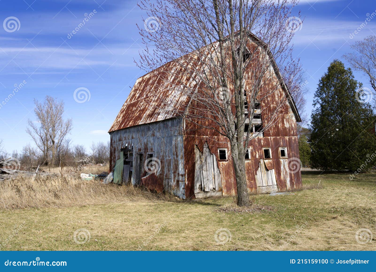 An Old Decrepit Barn on a Sunny Day Stock Photo - Image of water, lone ...