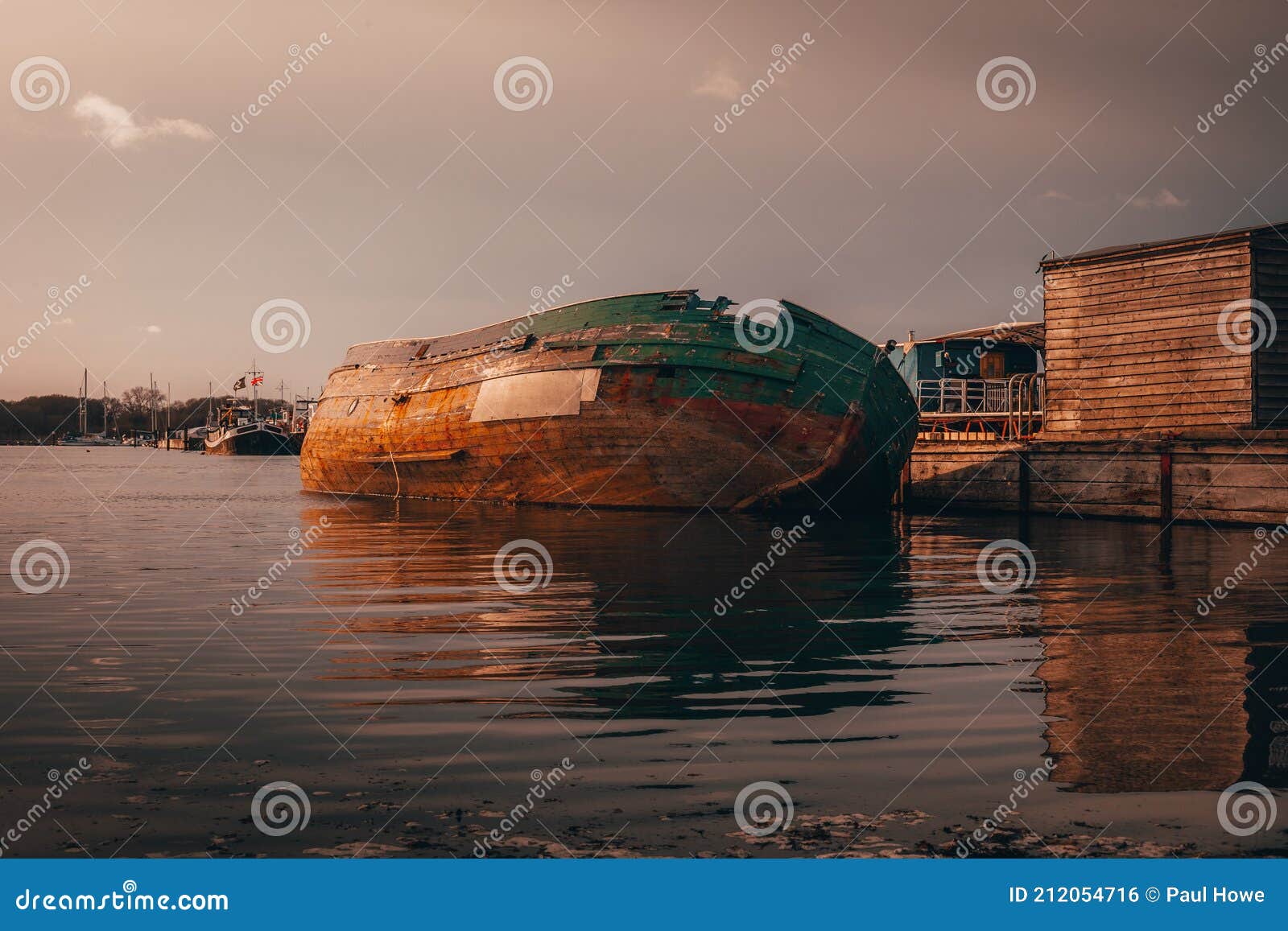 Old derelict boat sinking stock photo. Image of jetty - 212054716