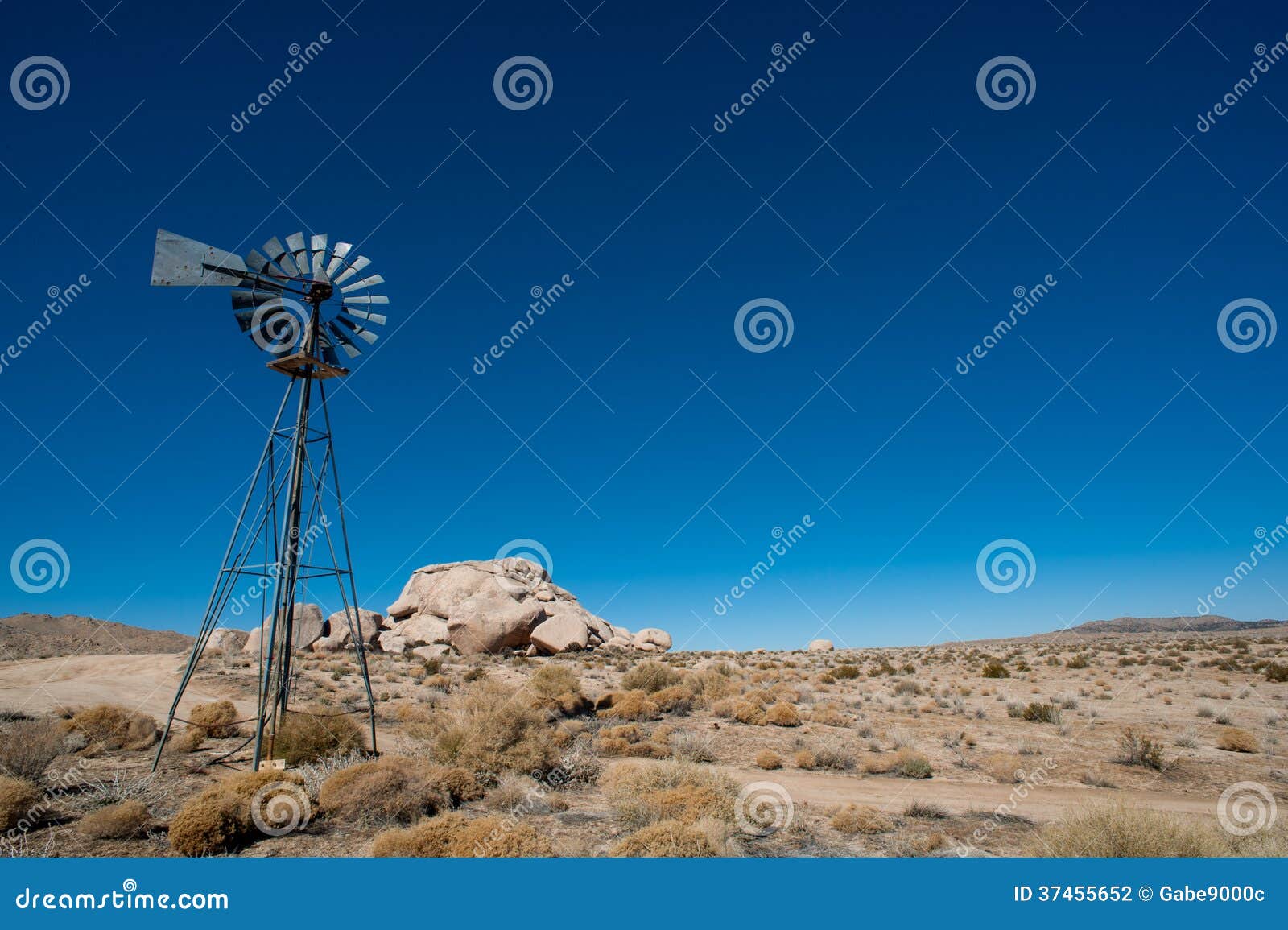Old desert Farm Windmill stock photo. Image of wooden - 37455652