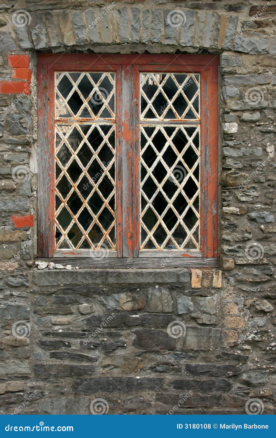 An Old Arched Leaded Window With A Concrete Frame In An Old English ...
