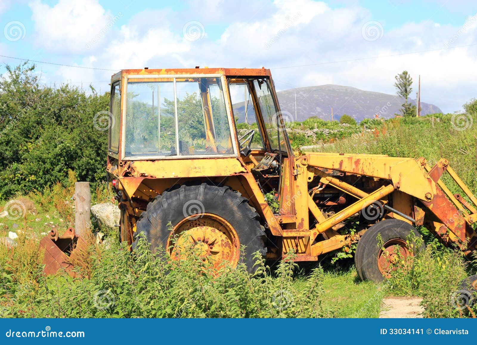 An Old Digger Rusting in the Weeds. Stock Image - Image of tractor ...