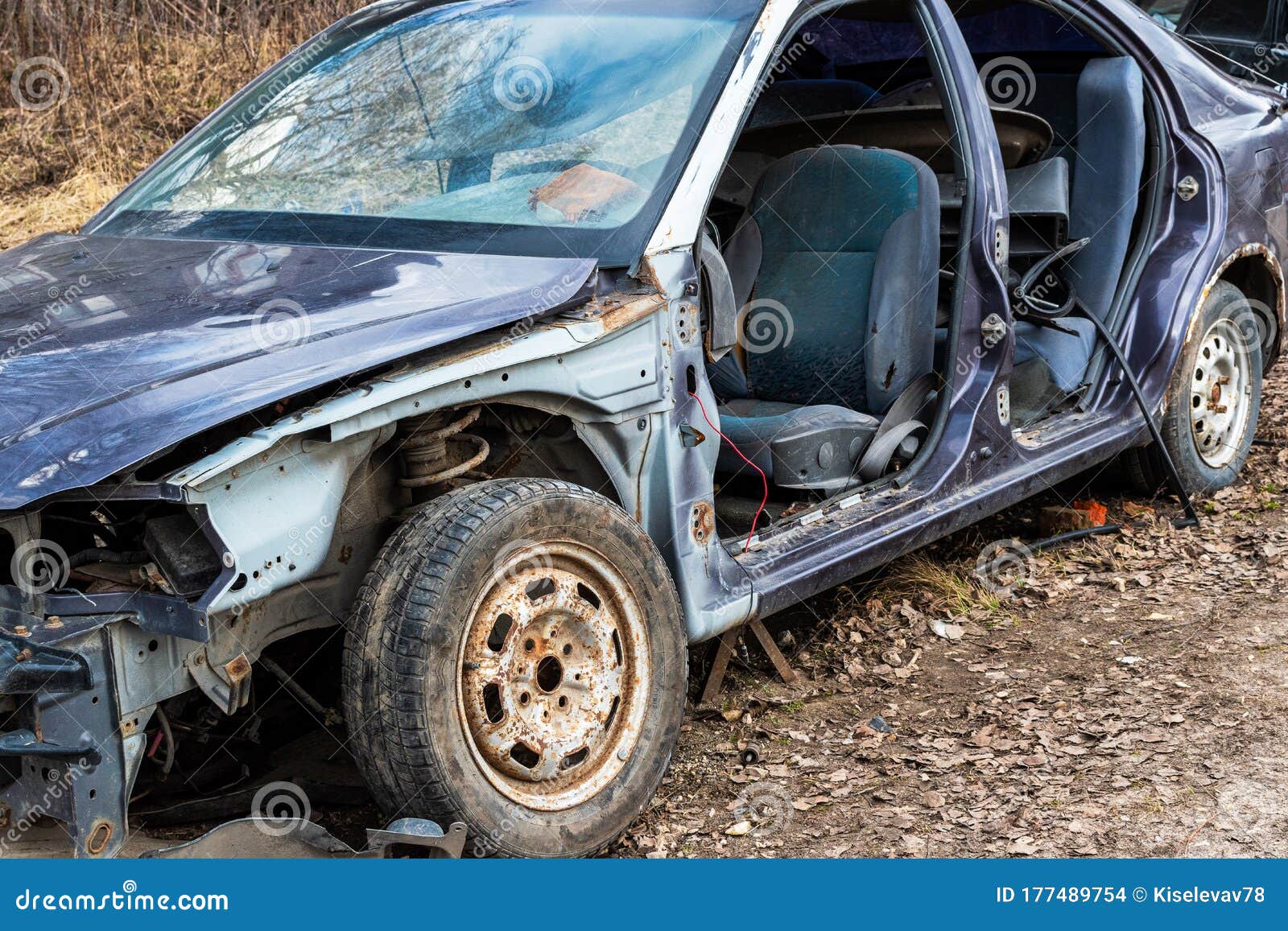 Old Dilapidated Car Abandoned on the Side of the Road. Close Up Stock ...