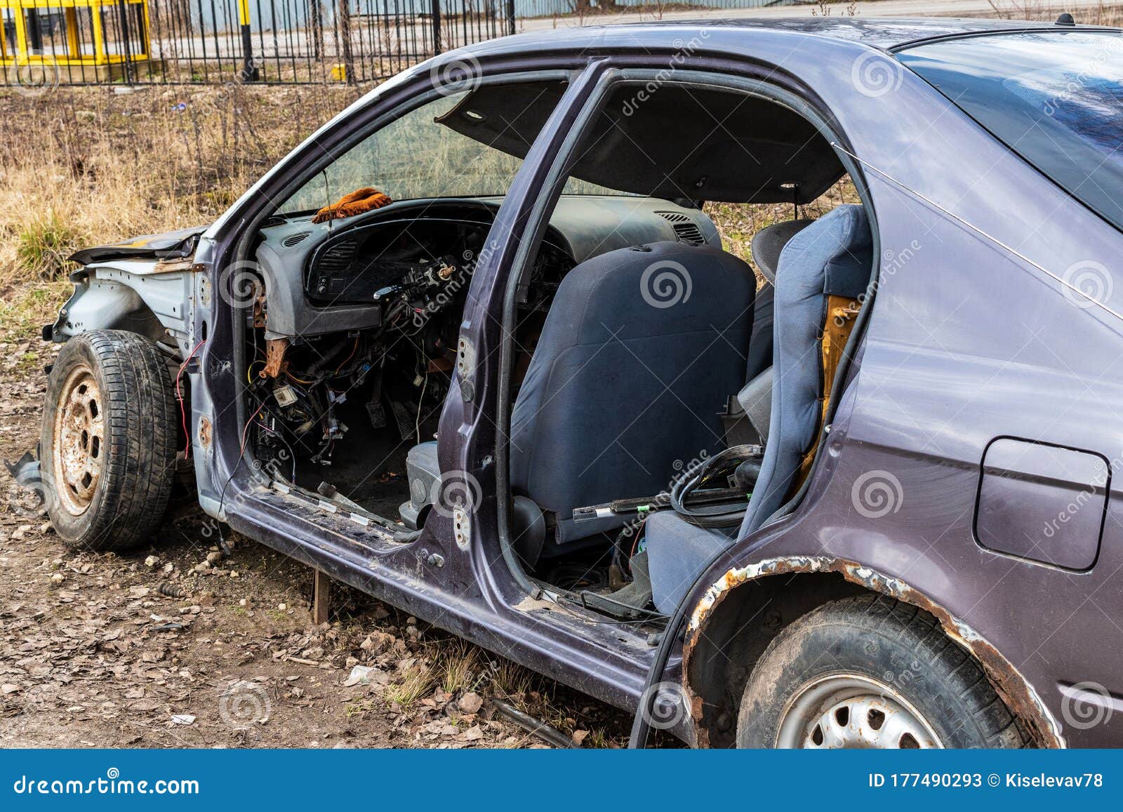 Old Dilapidated Car Abandoned on the Side of the Road. Close Up Stock ...