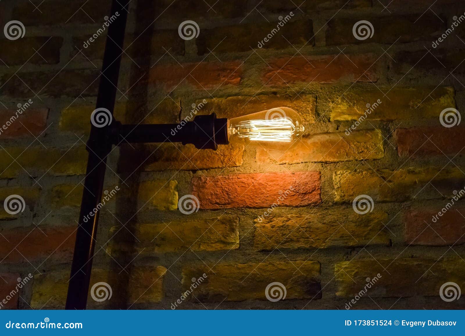 Old Dim Electric Lamp on a Brick Wall in Restaurant Stock Photo - Image ...