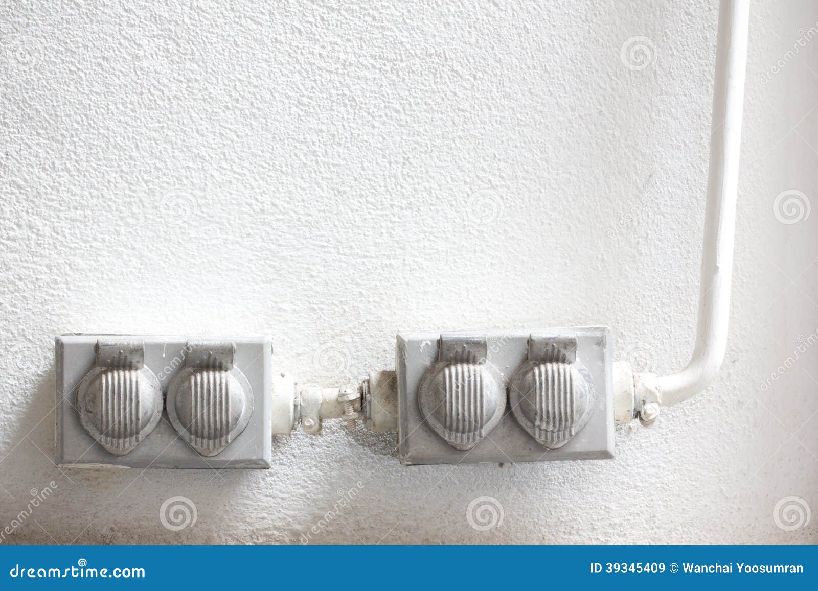 An Old, Dirty Electrical Cable Wire In The Brick Wall Of The Facade Of ...