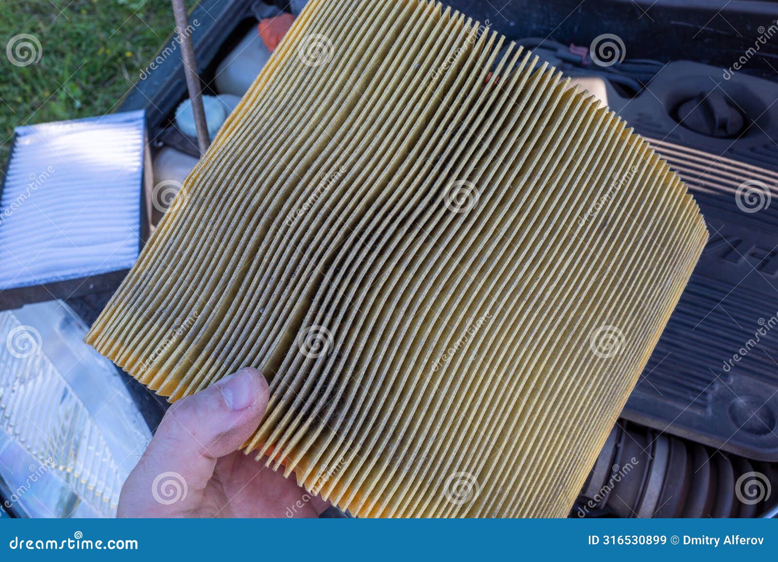 An Old Dirty Engine Filter in the Hands of an Auto Mechanic ...