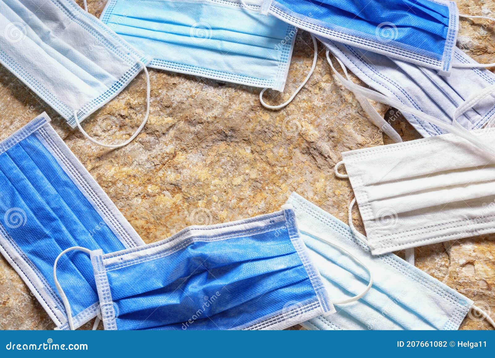 Old Discarded Medical Face Masks on Stones. Environmental Pollution ...