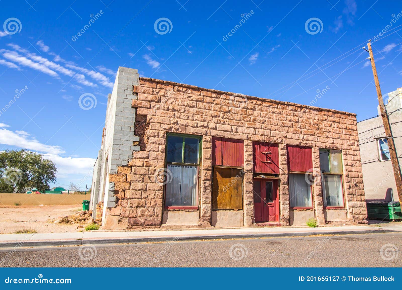 Old Distressed Brick Commercial Store Front Building with Boarded Up ...