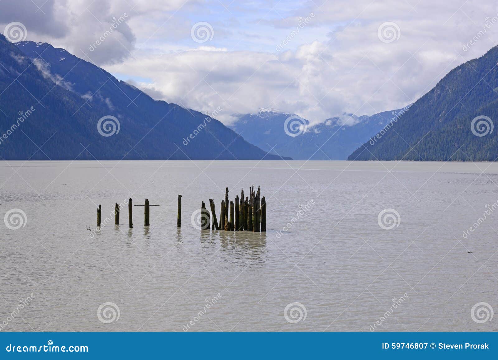 Old Dock Posts in an Ocean Bay Stock Image - Image of mountains ...