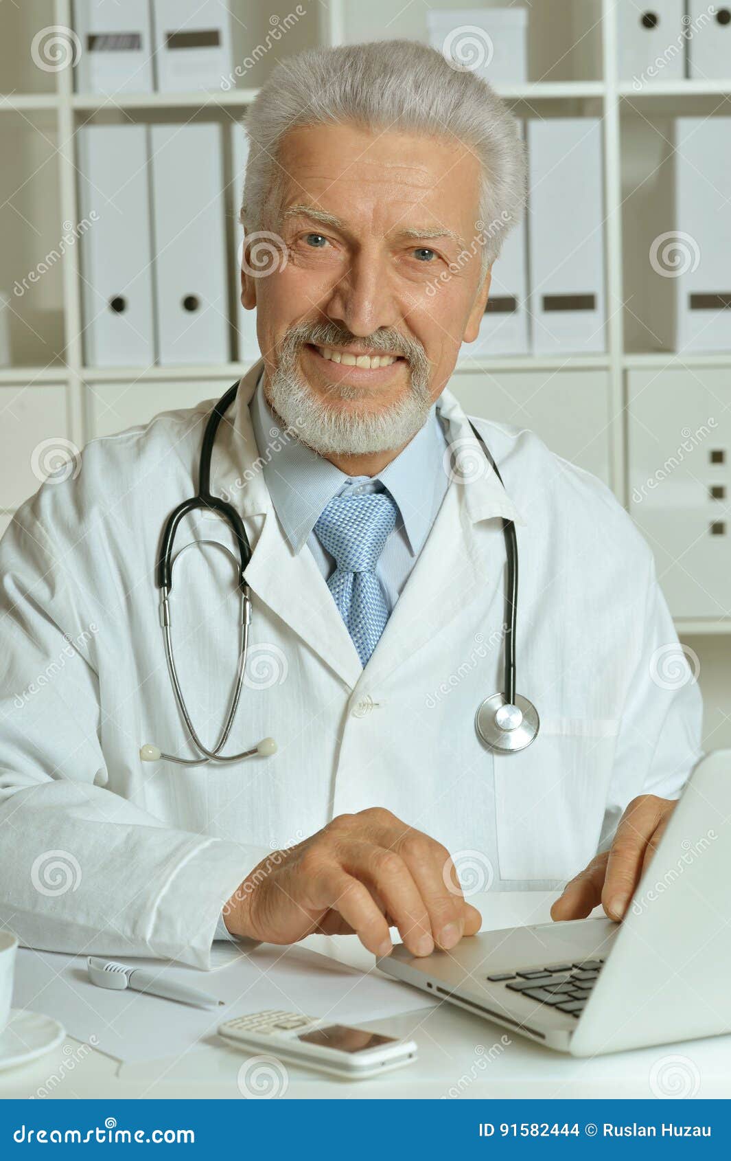 Old Doctor with a Laptop Working Stock Photo - Image of sitting ...