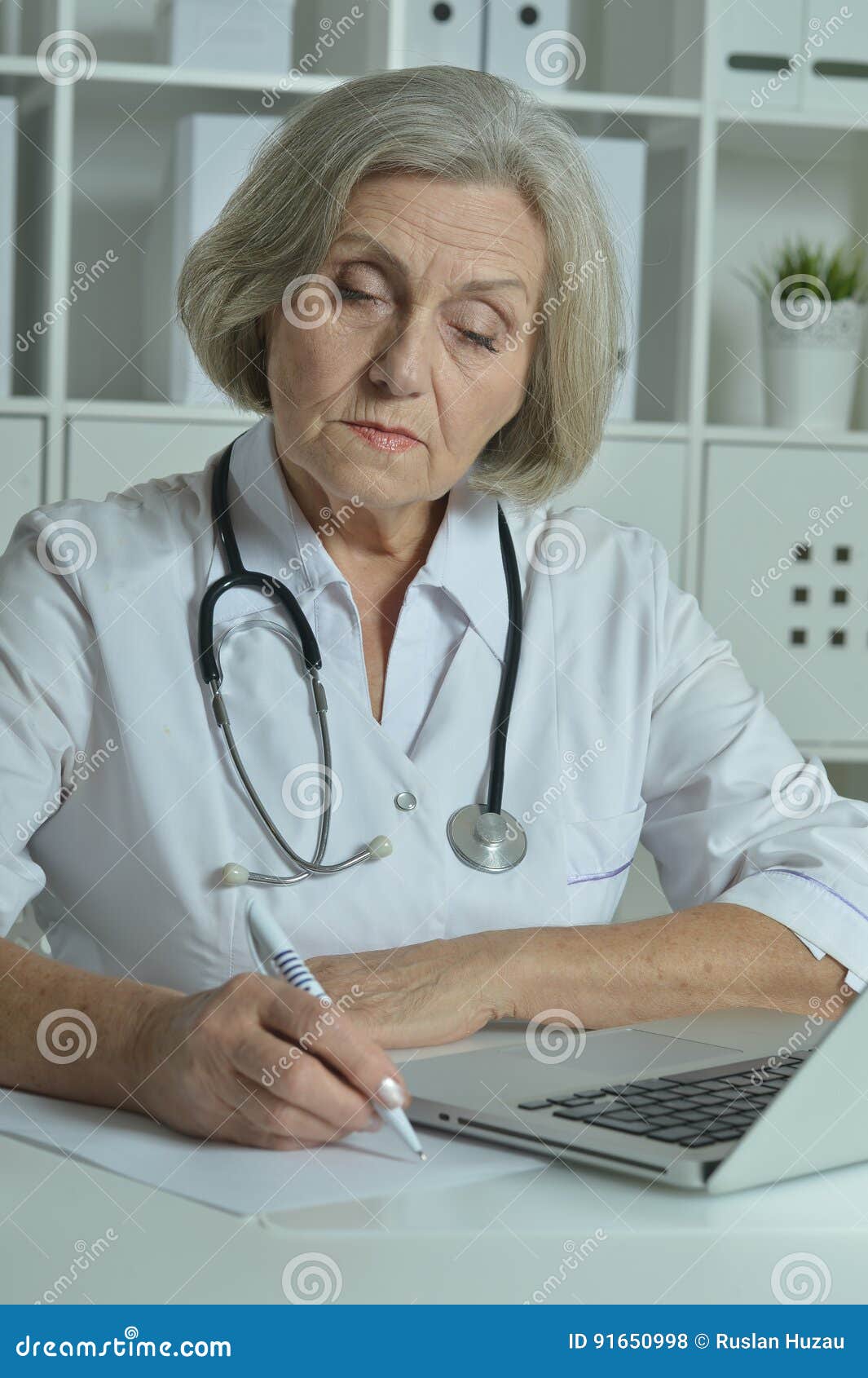 Old Doctor with a Laptop Working Stock Photo - Image of doctor, people ...