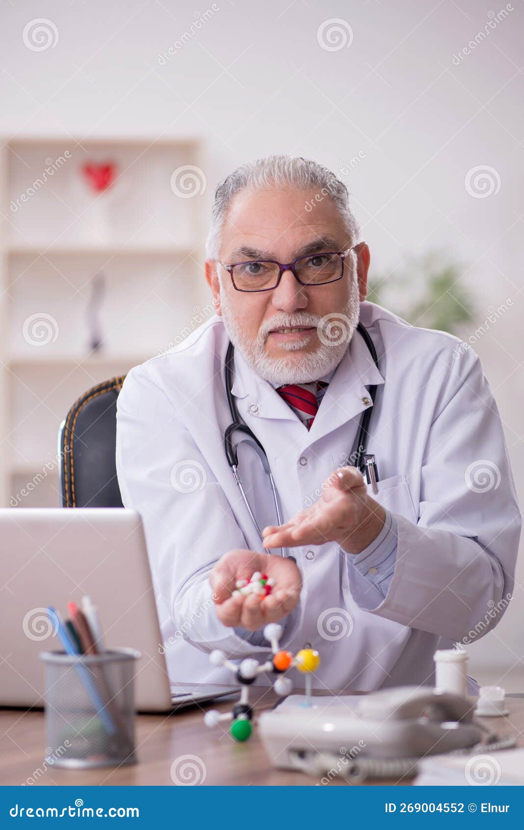 Old Male Doctor Working in the Clinic Stock Photo - Image of doctor ...