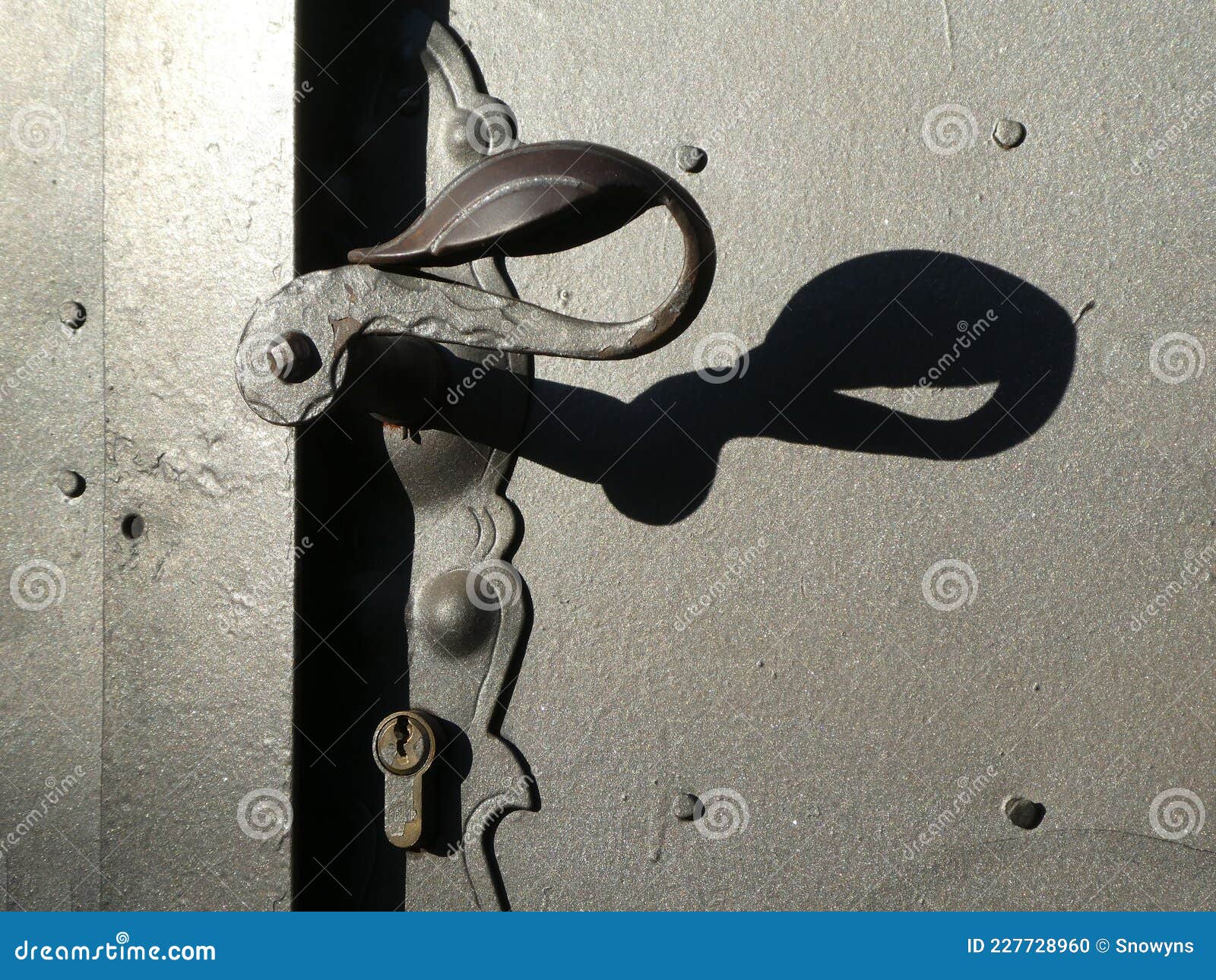 Old Door Handle with Shadow and Keyhole on the Door Stock Photo - Image ...