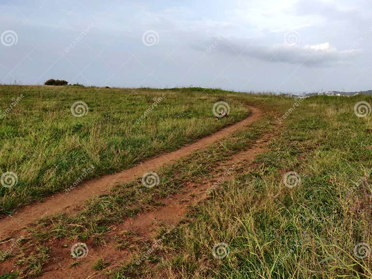 An Old Earthen Road Path Running Beyond the Hills Stock Image - Image ...