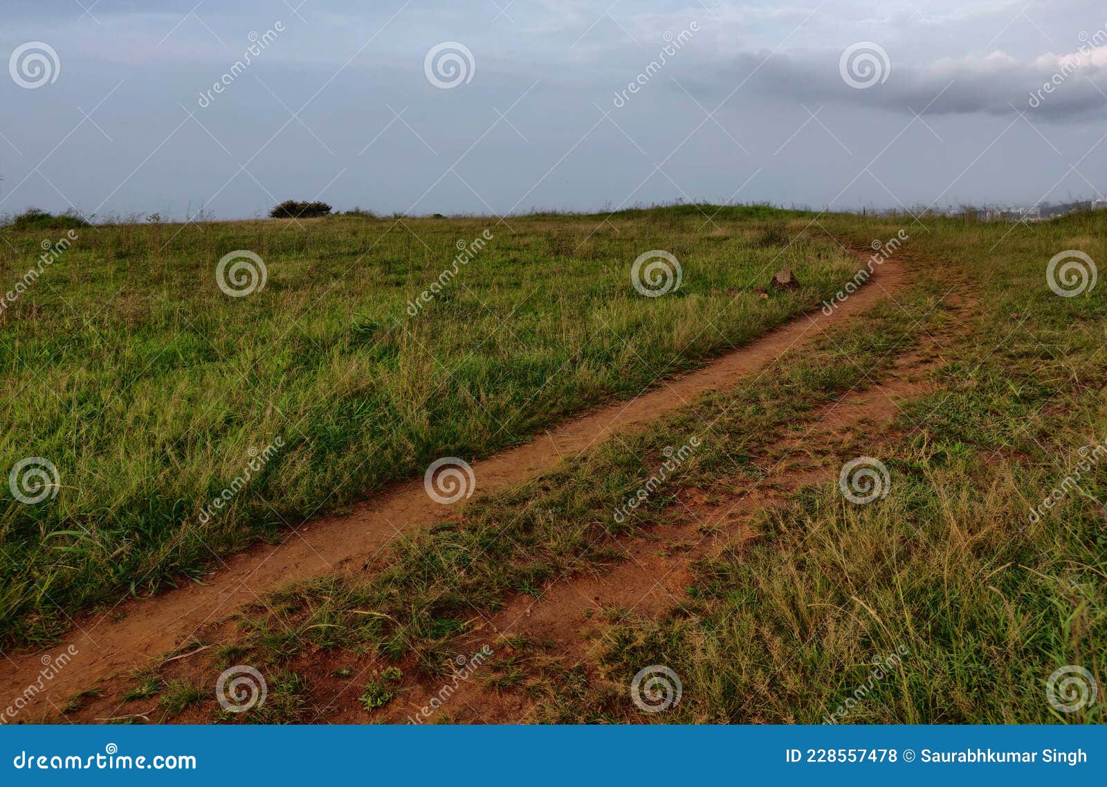 An Old Earthen Road Path Running Beyond the Hills Stock Photo - Image ...