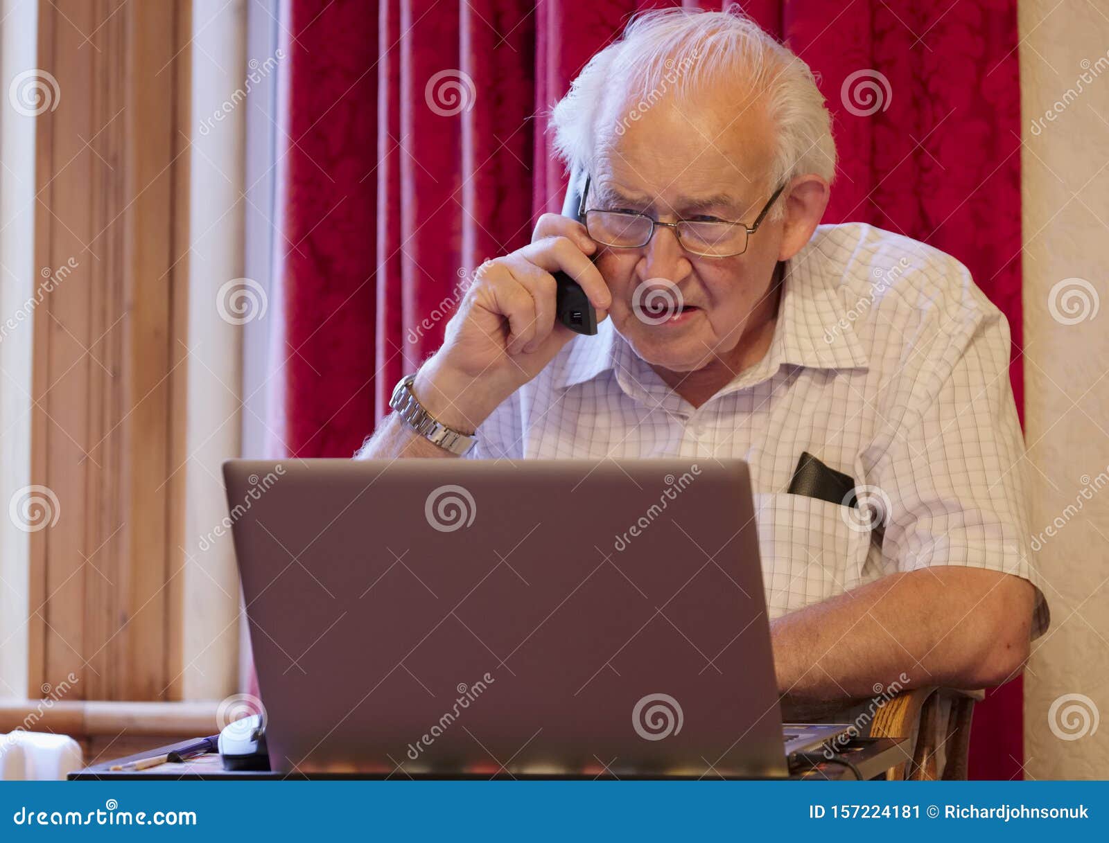 Old Elderly Senior Man on Phone at Laptop Computer at Risk To Cyber ...
