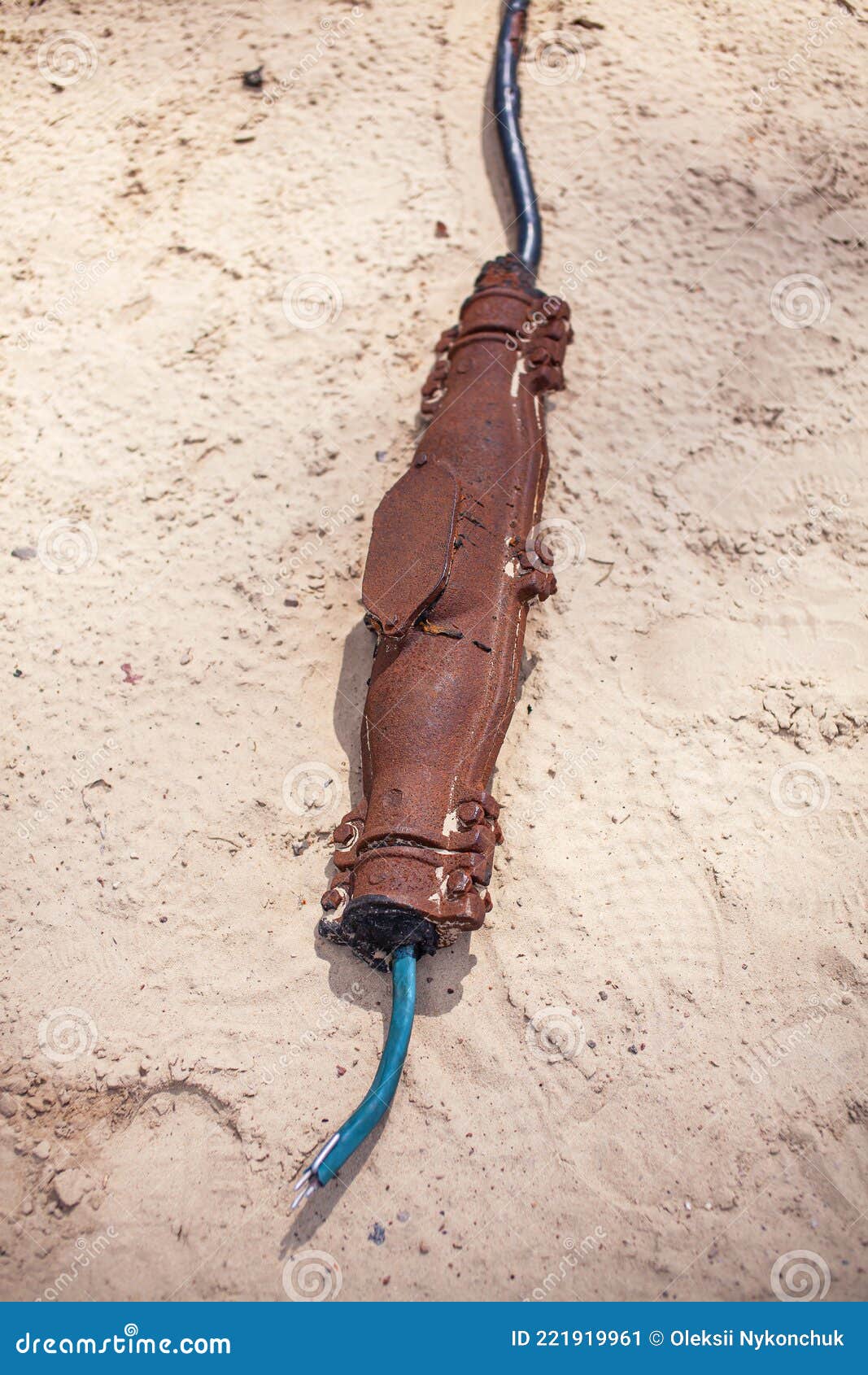 An Old Electrical Cable Lies on the Sand Stock Image - Image of dirty ...