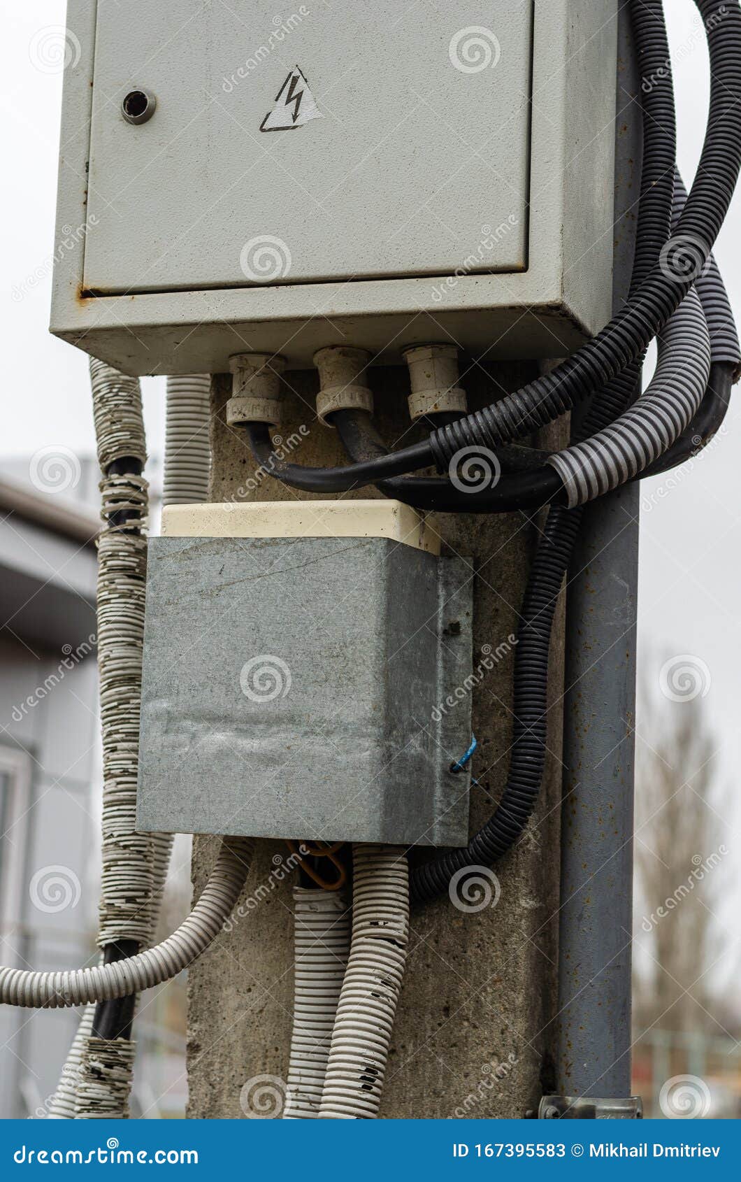An Old Electrical Panel, a Rusty Metal Box Hangs on the Shield of an ...