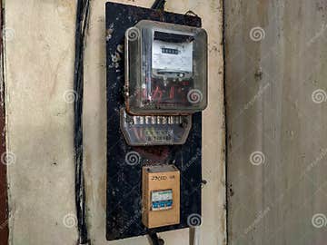 An Old Electricity Meter Mounted on a Worn Wall Stock Image - Image of ...