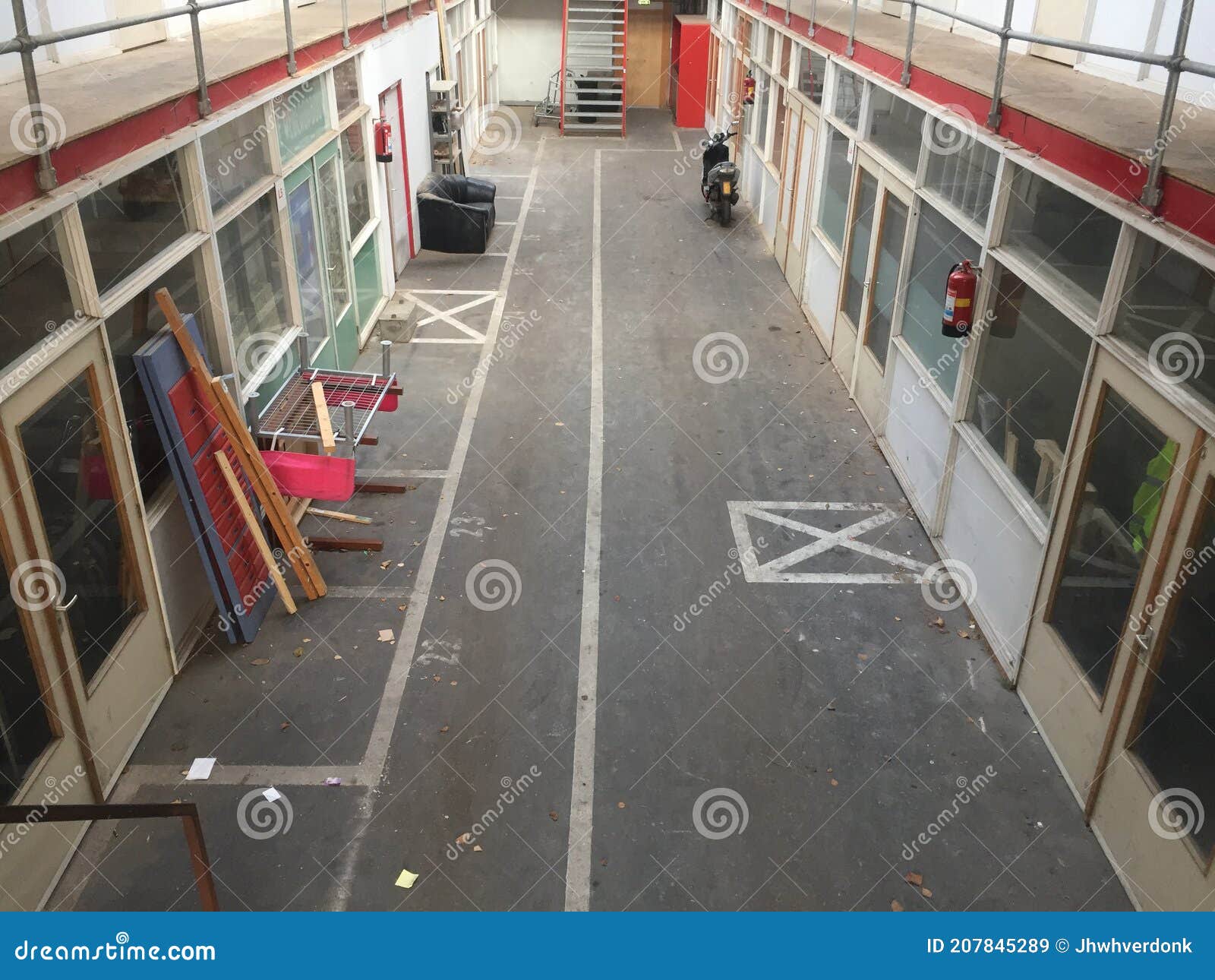 An Old and almost Empty Warehouse with Garbage Piled Up at One Side ...