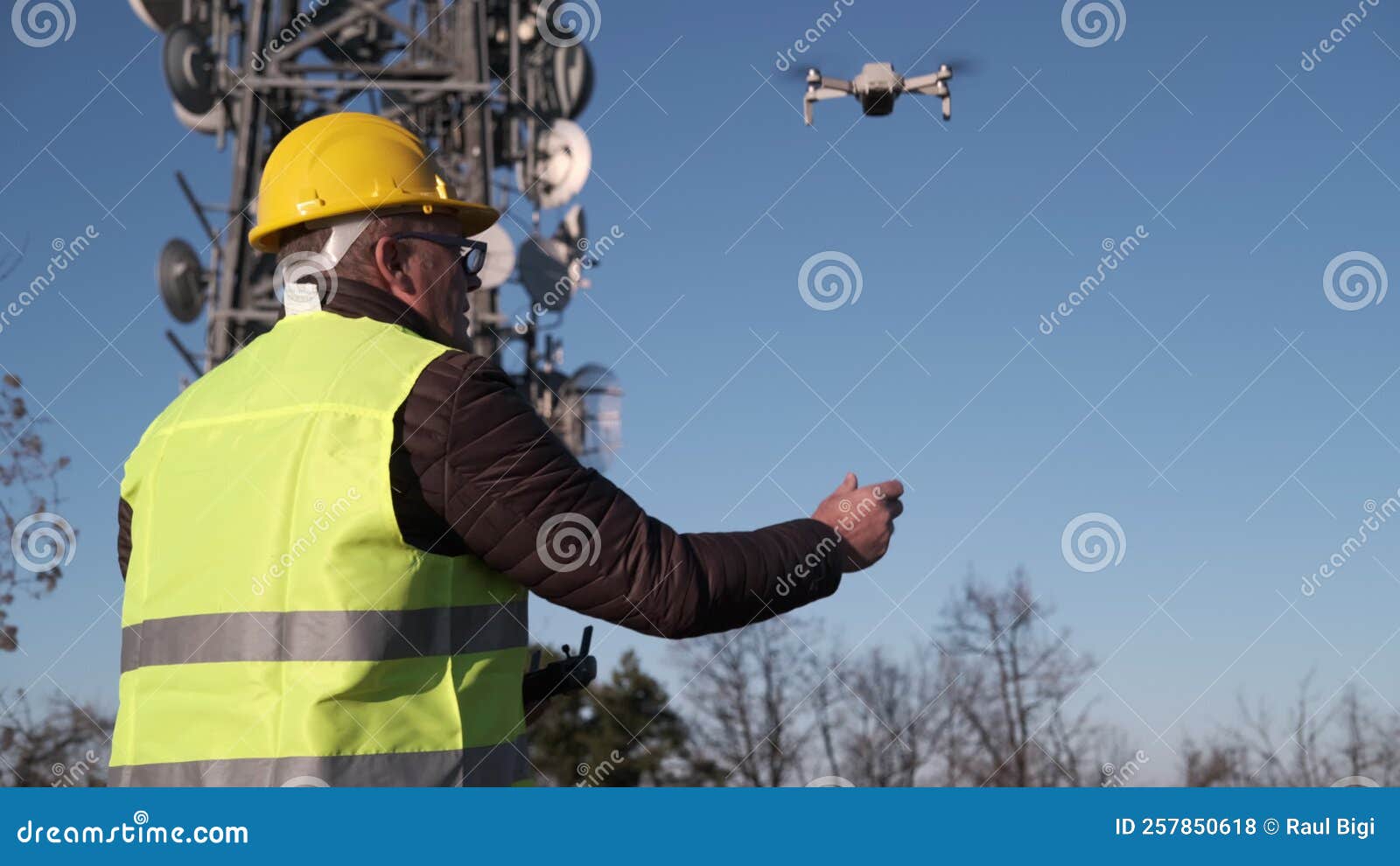 Civil Engineer Operating a Drone with Remote Control Lands the Drone at ...