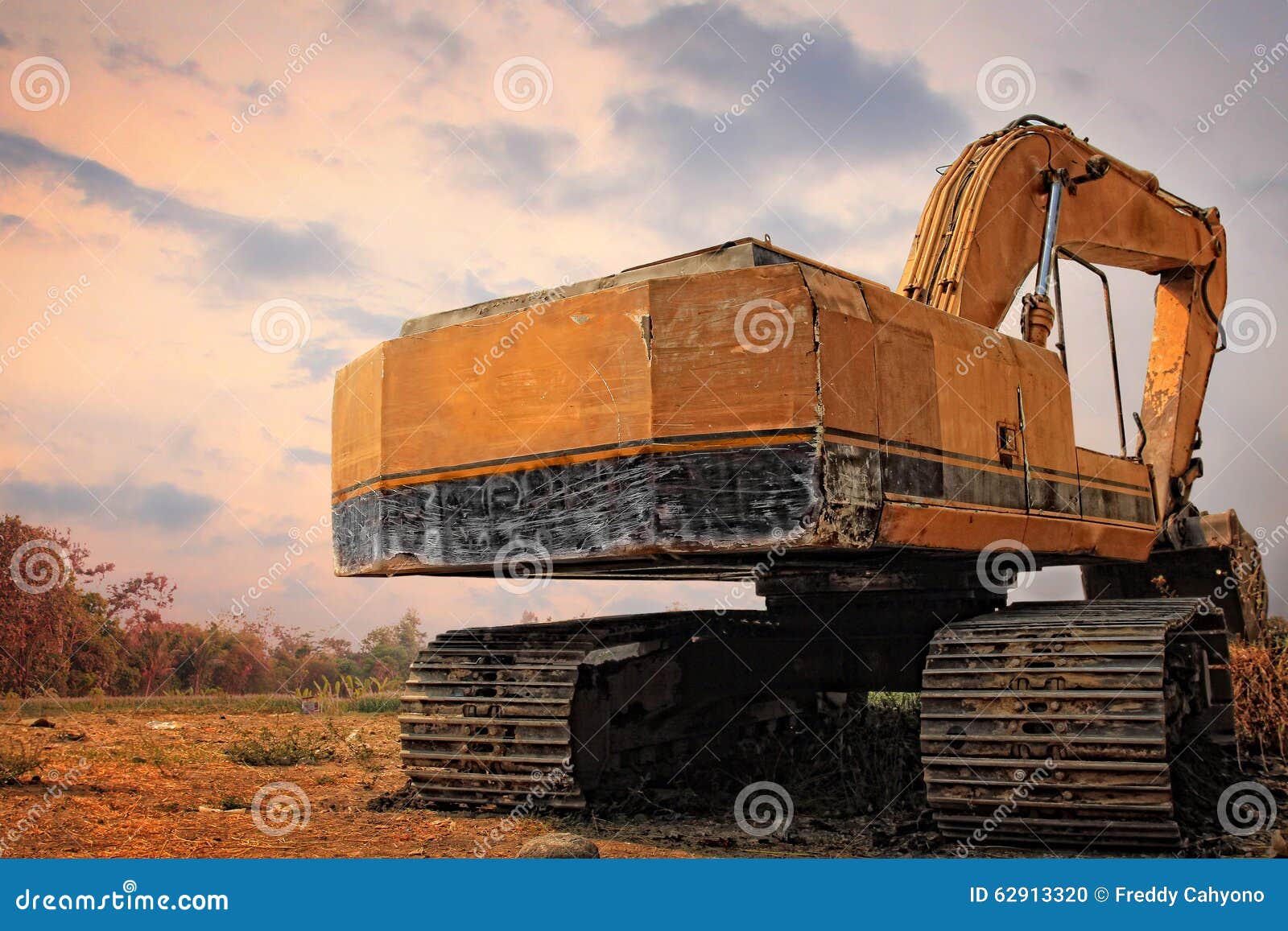 Old excavator on a field stock photo. Image of broken - 62913320