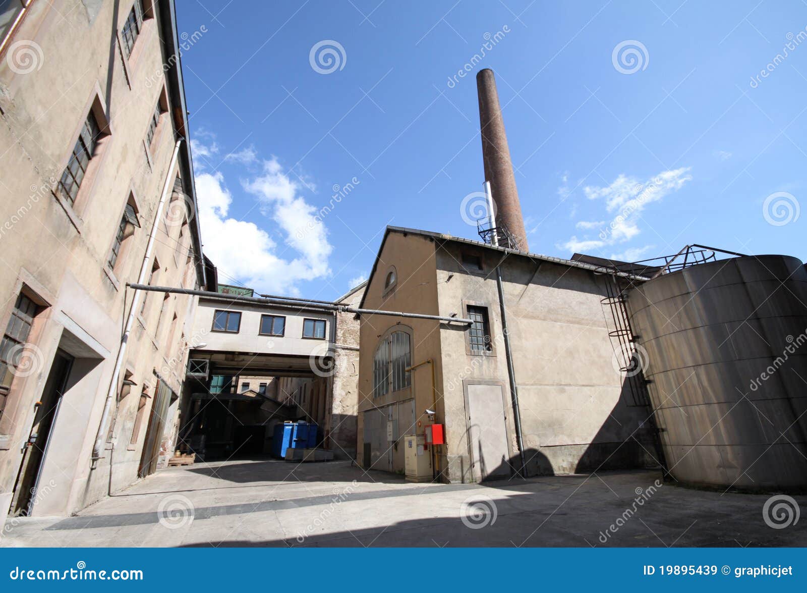Old factory courtyard stock image. Image of machinery - 19895439