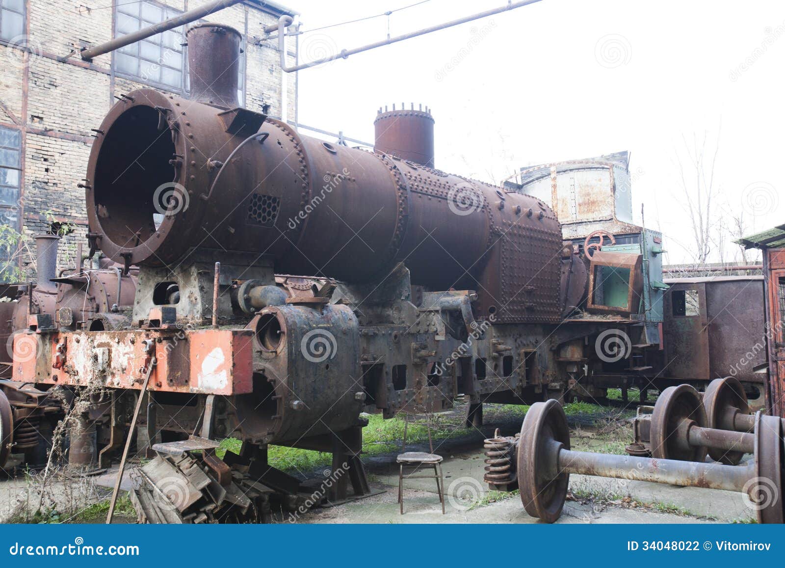 Old Rusty Locomotive Stands On The Rails On The Background Of Blue Sky ...