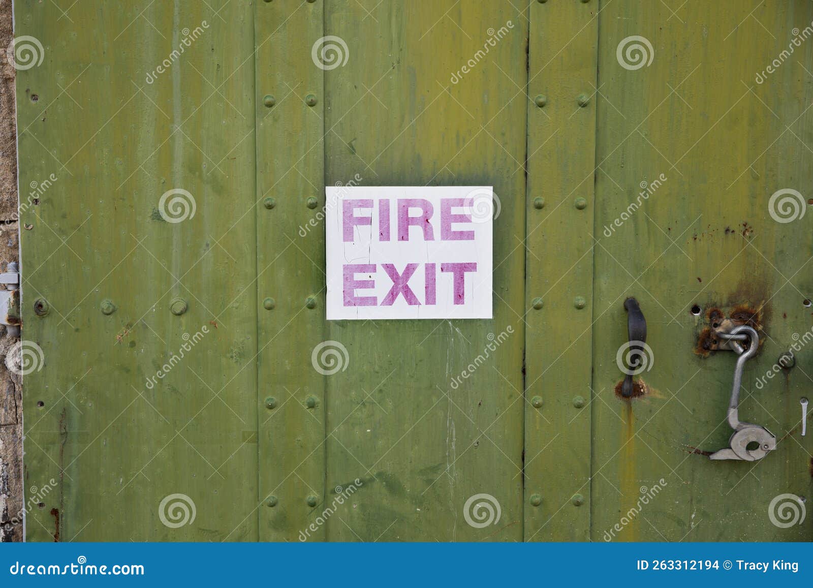 Old faded fire exit sign stock photo. Image of direction - 263312194