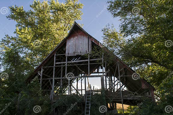 Old Falling Down Barn stock photo. Image of blue, clouds - 60068558