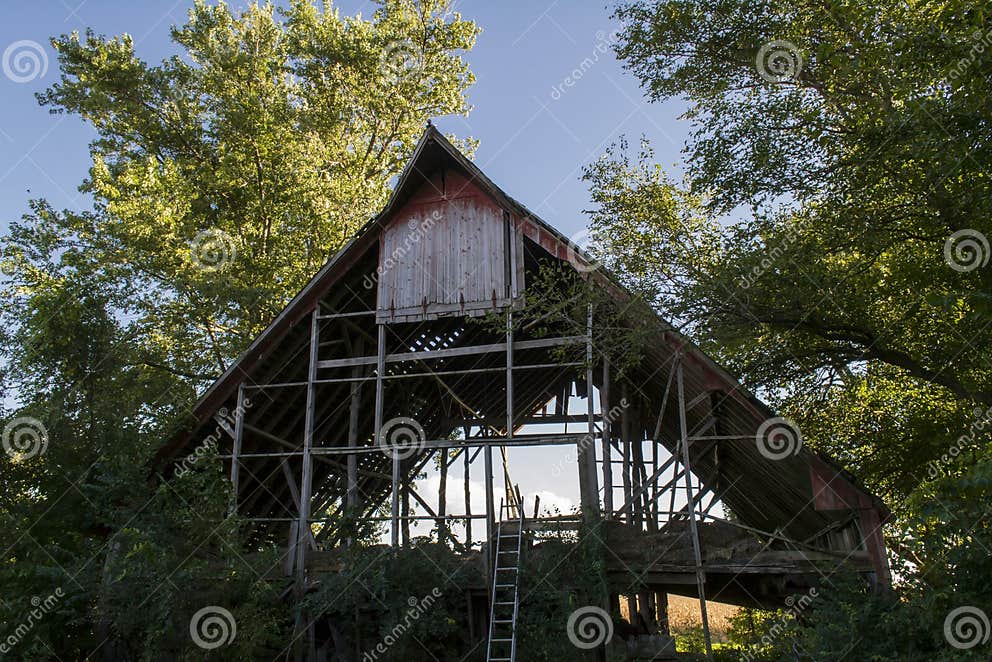 Old Falling Down Barn stock photo. Image of blue, clouds - 60068558